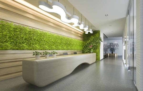 Modern hotel lobby with green wall - AplosGroup - Architecture